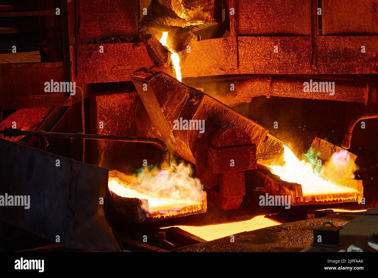 Pouring molten copper for anodes into form on casting wheel Stock Photo ...