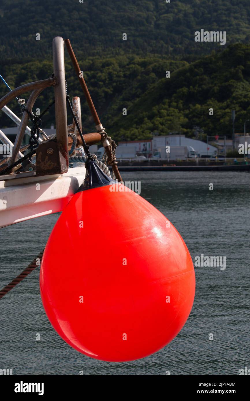 Large red PVC boat buoy Stock Photo - Alamy