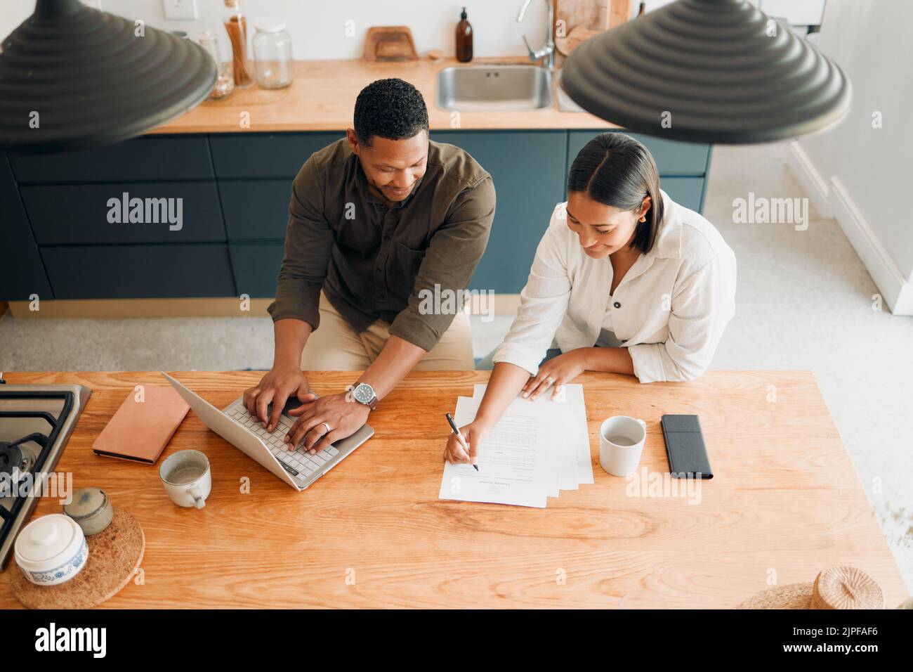 Couple calculating budget, finance and tax while planning investment, loan and bills at home ...