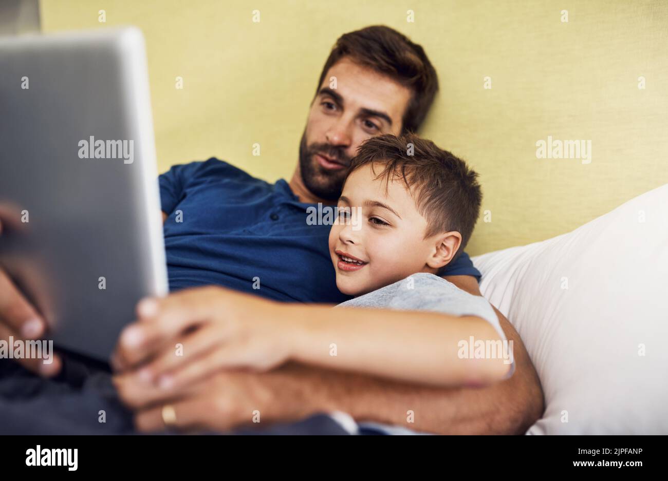 Technology provides even more ways to bond. a young man using a digital ...