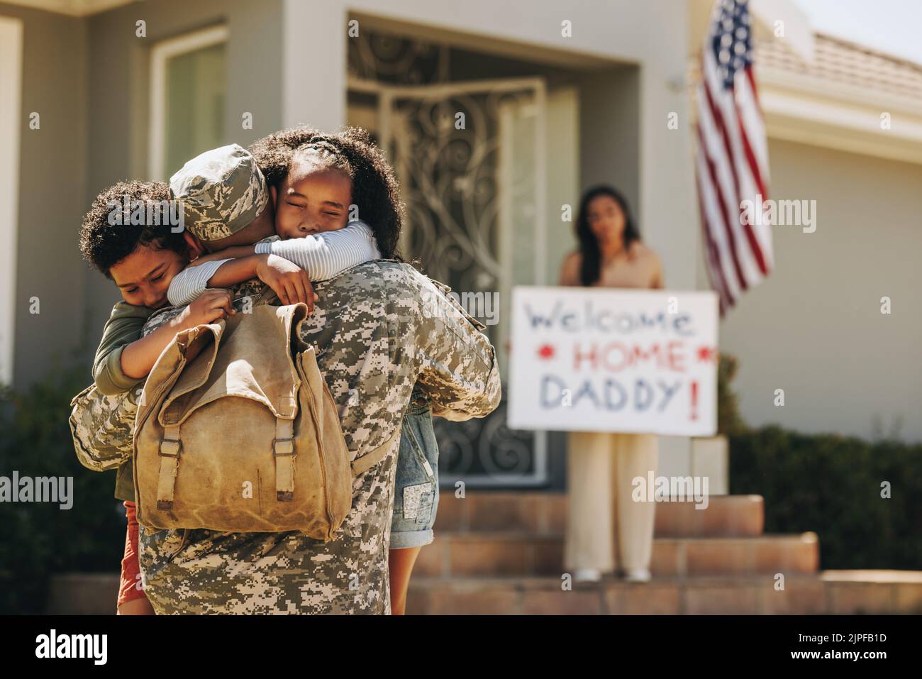 Two young children reuniting with their military father at home ...