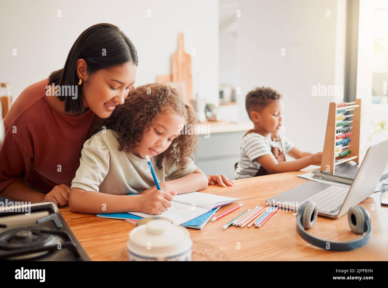 Education, learning and homework with a mother teaching and helping her ...
