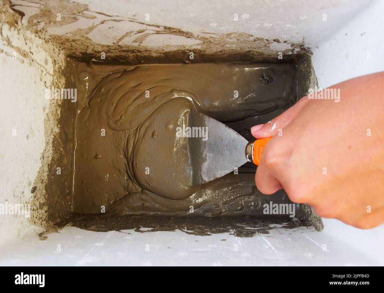 Cement powder Mixed by hand and Metal trowel. Wall Painting Preparation ...