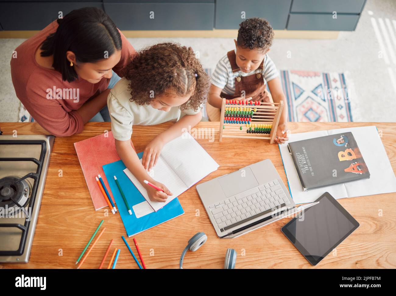 Learning, education and family doing homework with girl child writing ...