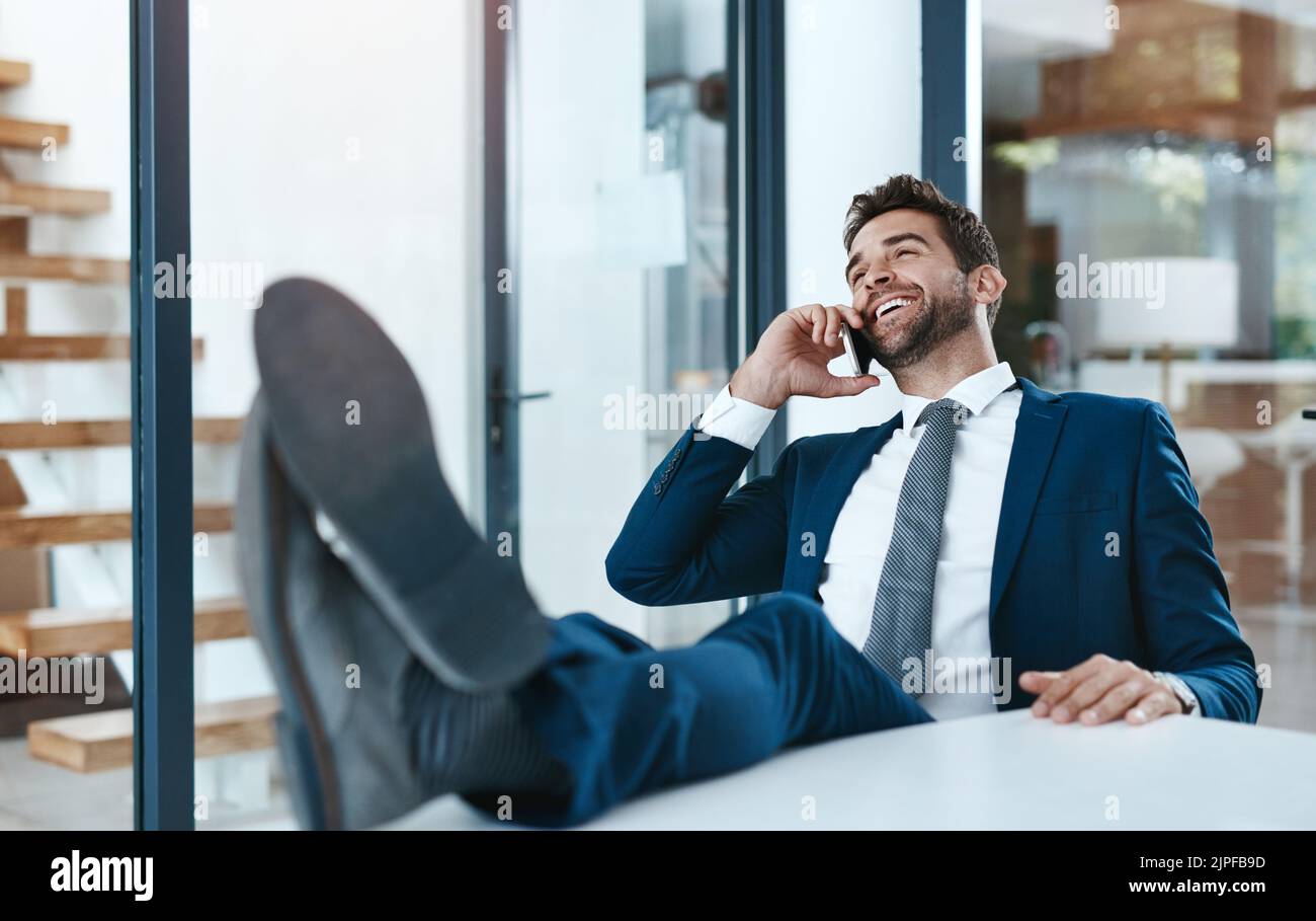 Making millions with one phone call. a handsome young businessman ...