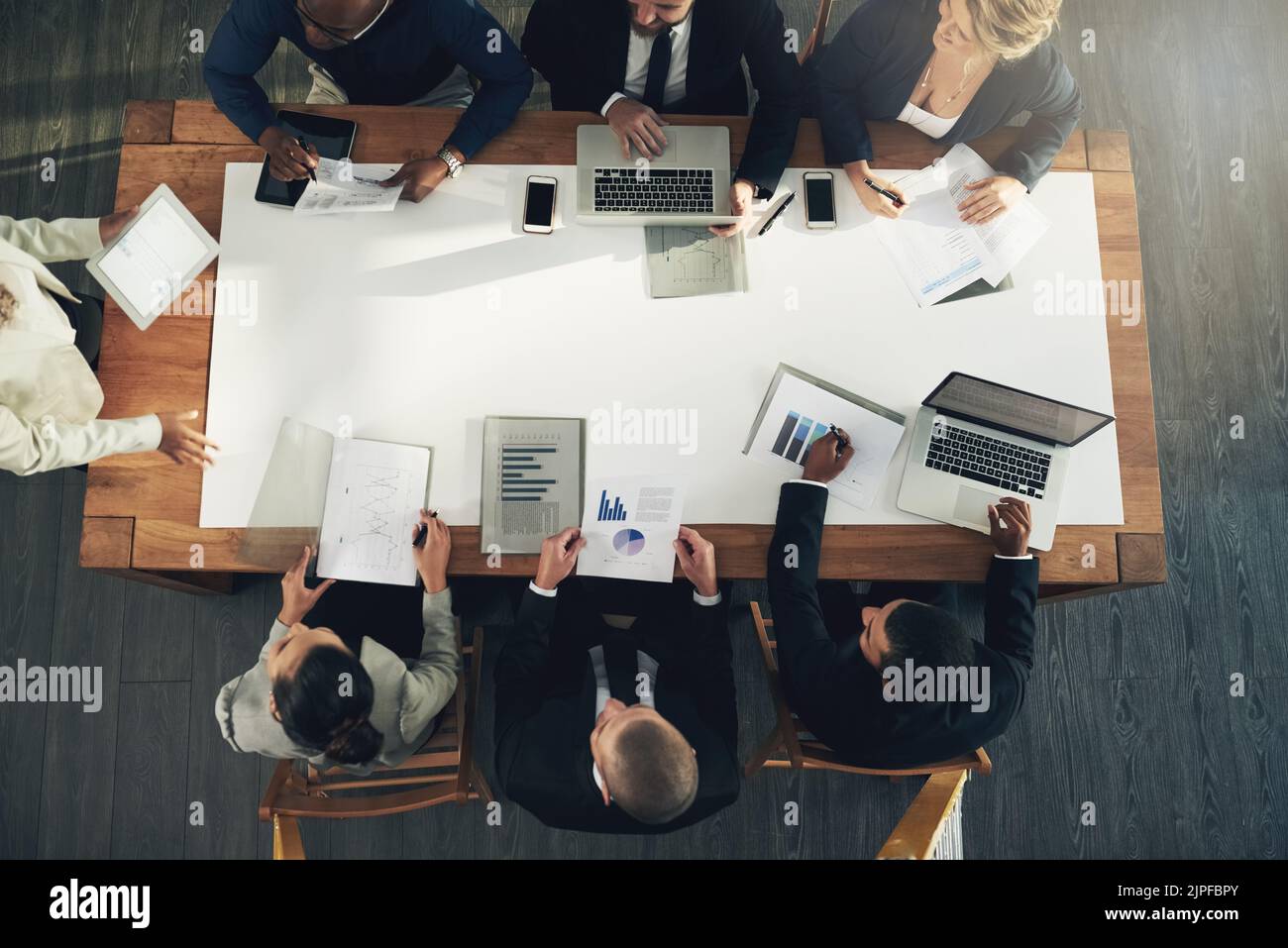 Putting the team to work. High angle shot of a team of businesspeople ...