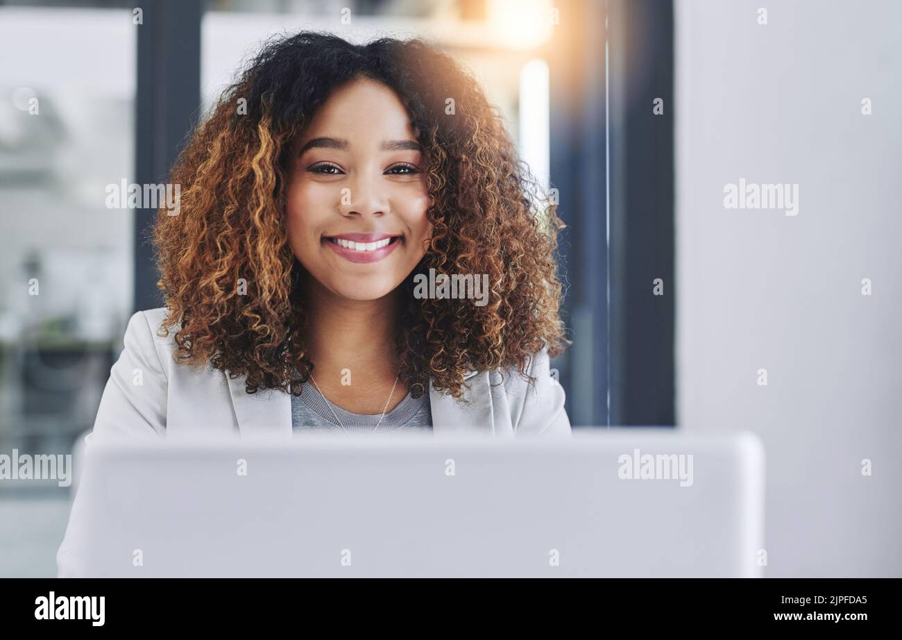 Positivity really does boost productivity. Portrait of a young ...