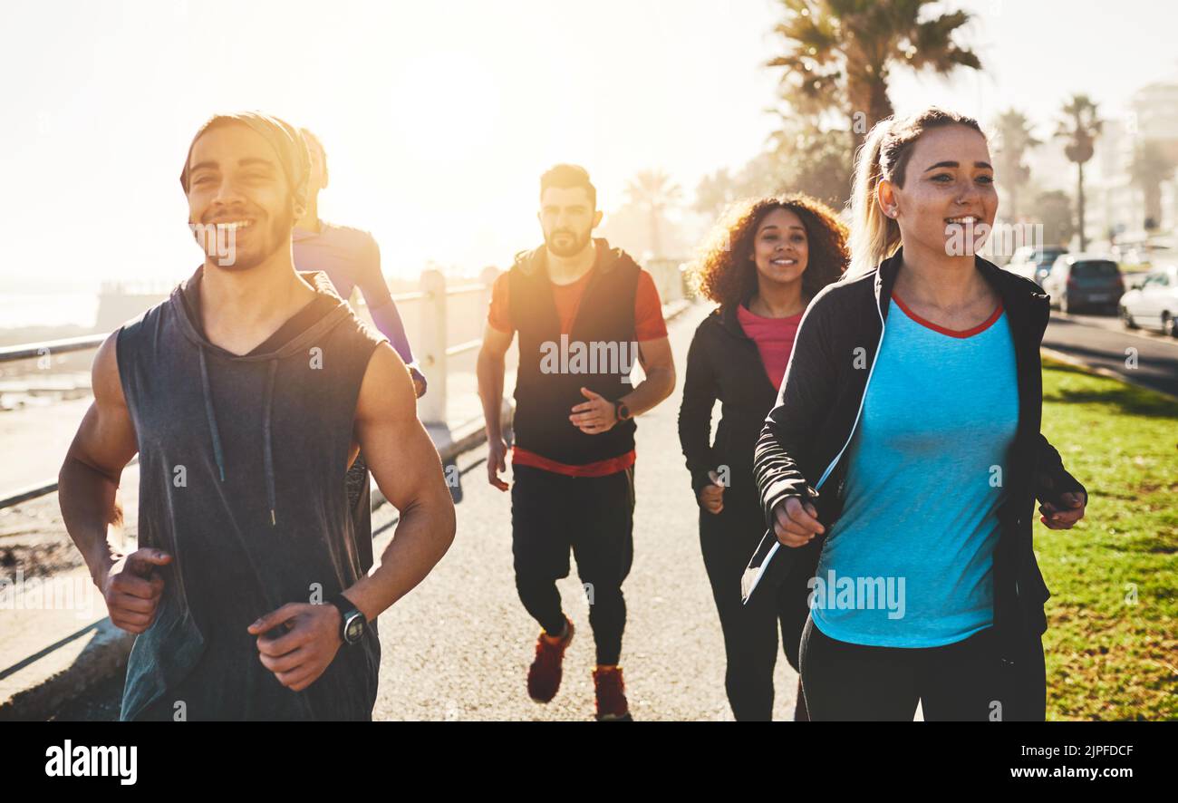Miles fly when youre having fun. a fitness group out running on the ...