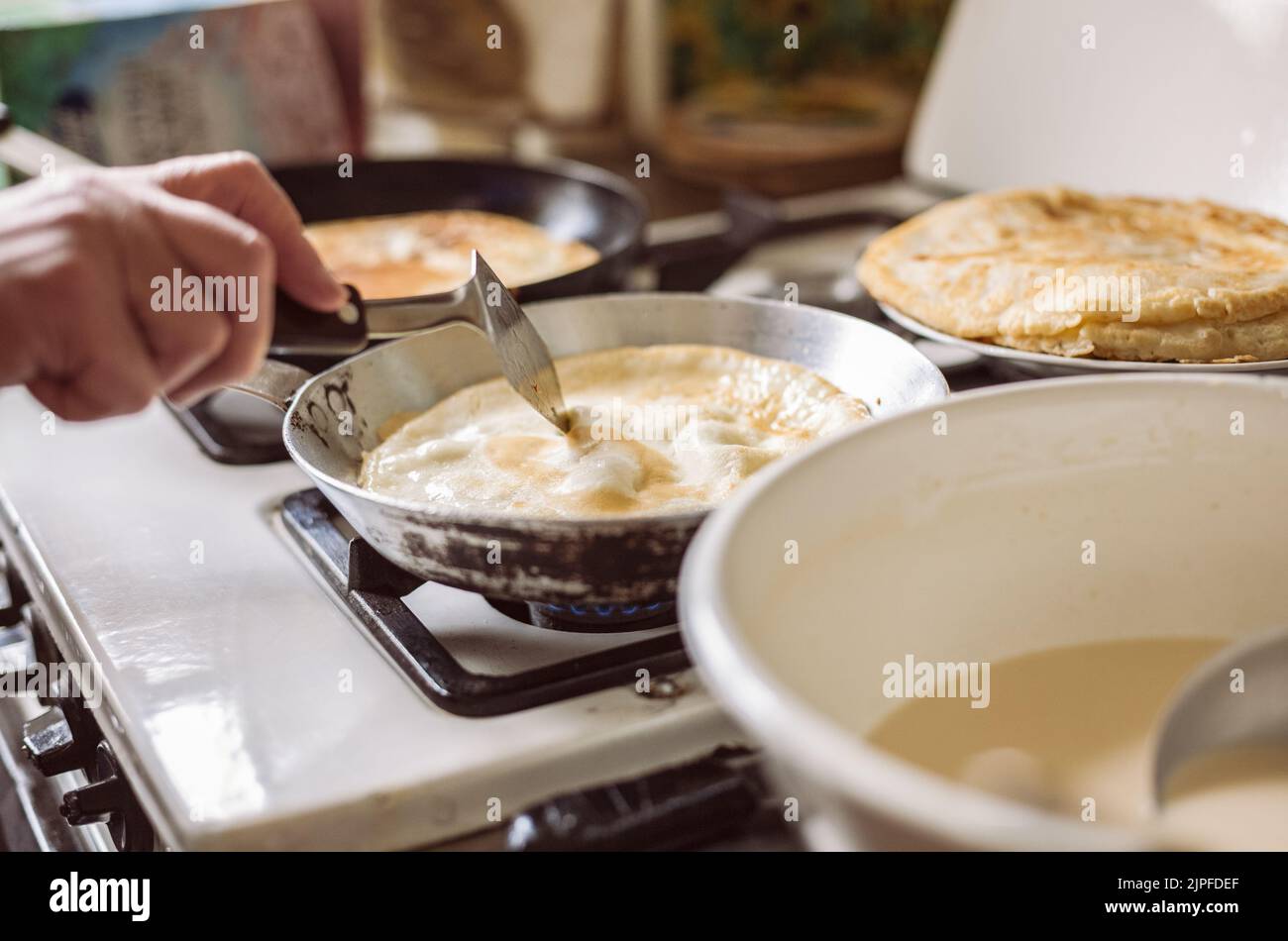 Grandmother making pancakes Stock Photo - Alamy