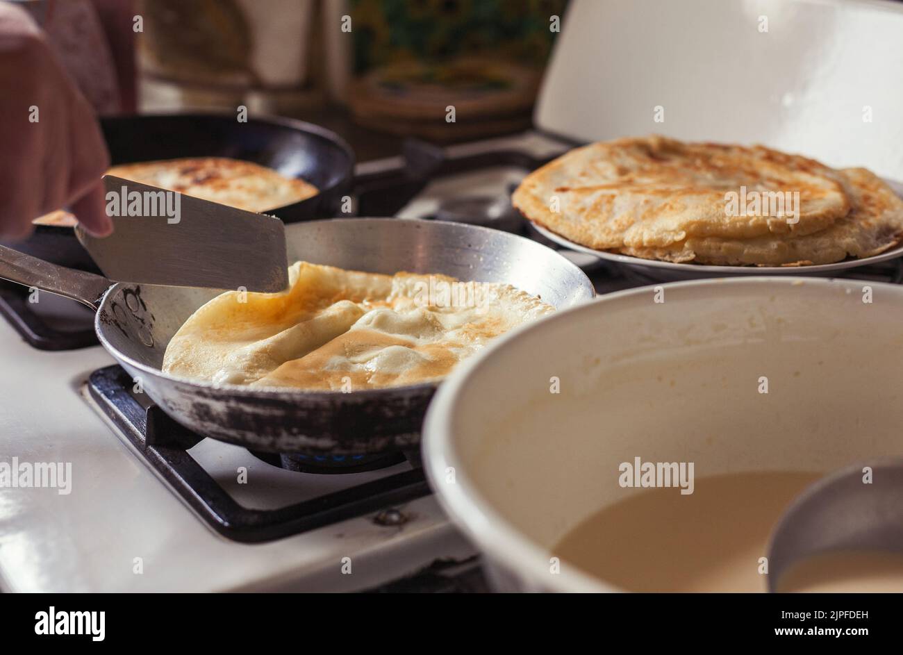 Grandmother making pancakes Stock Photo - Alamy
