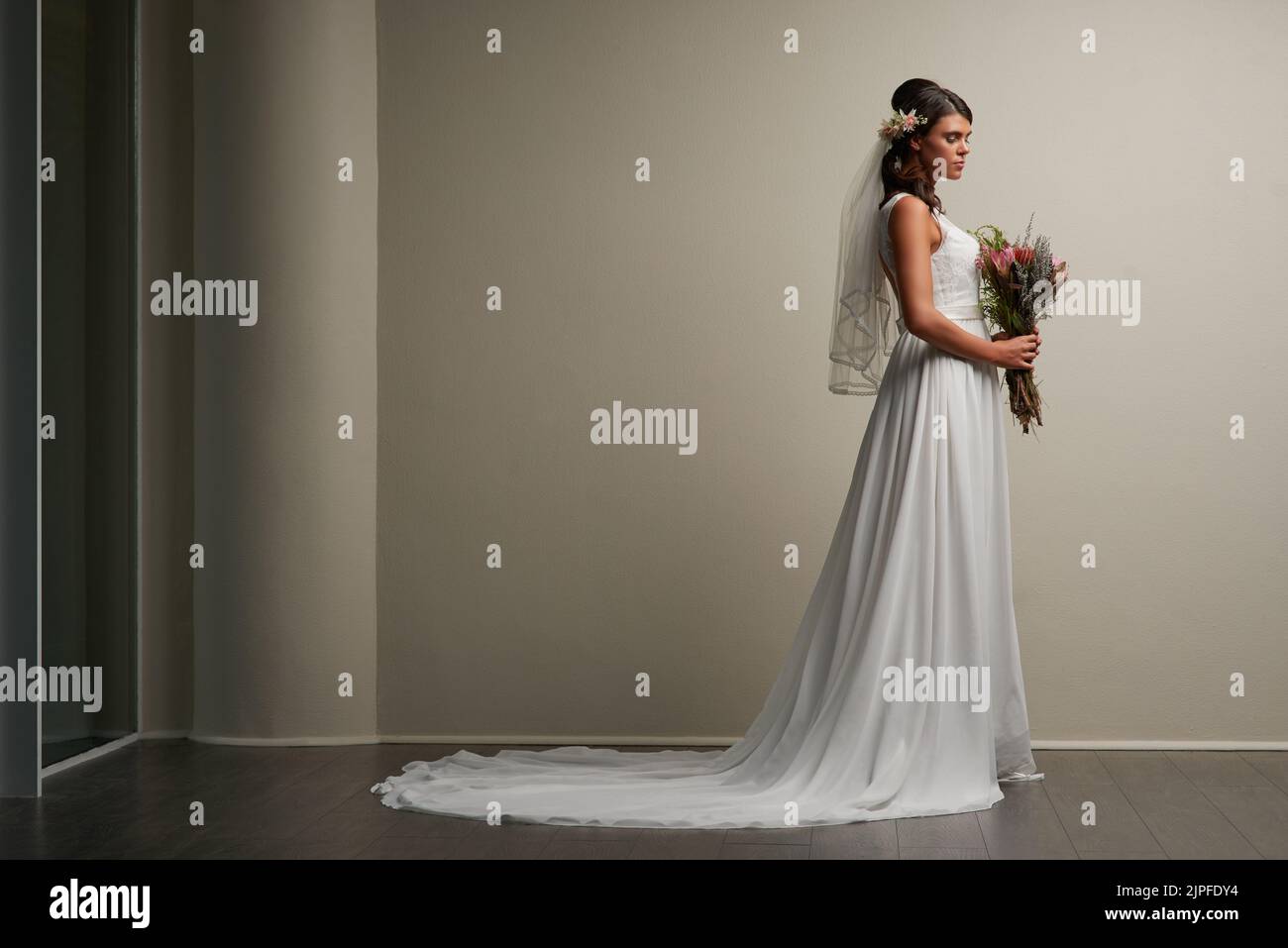 Stunning is the bride to be. Studio shot of a young beautiful bride ...