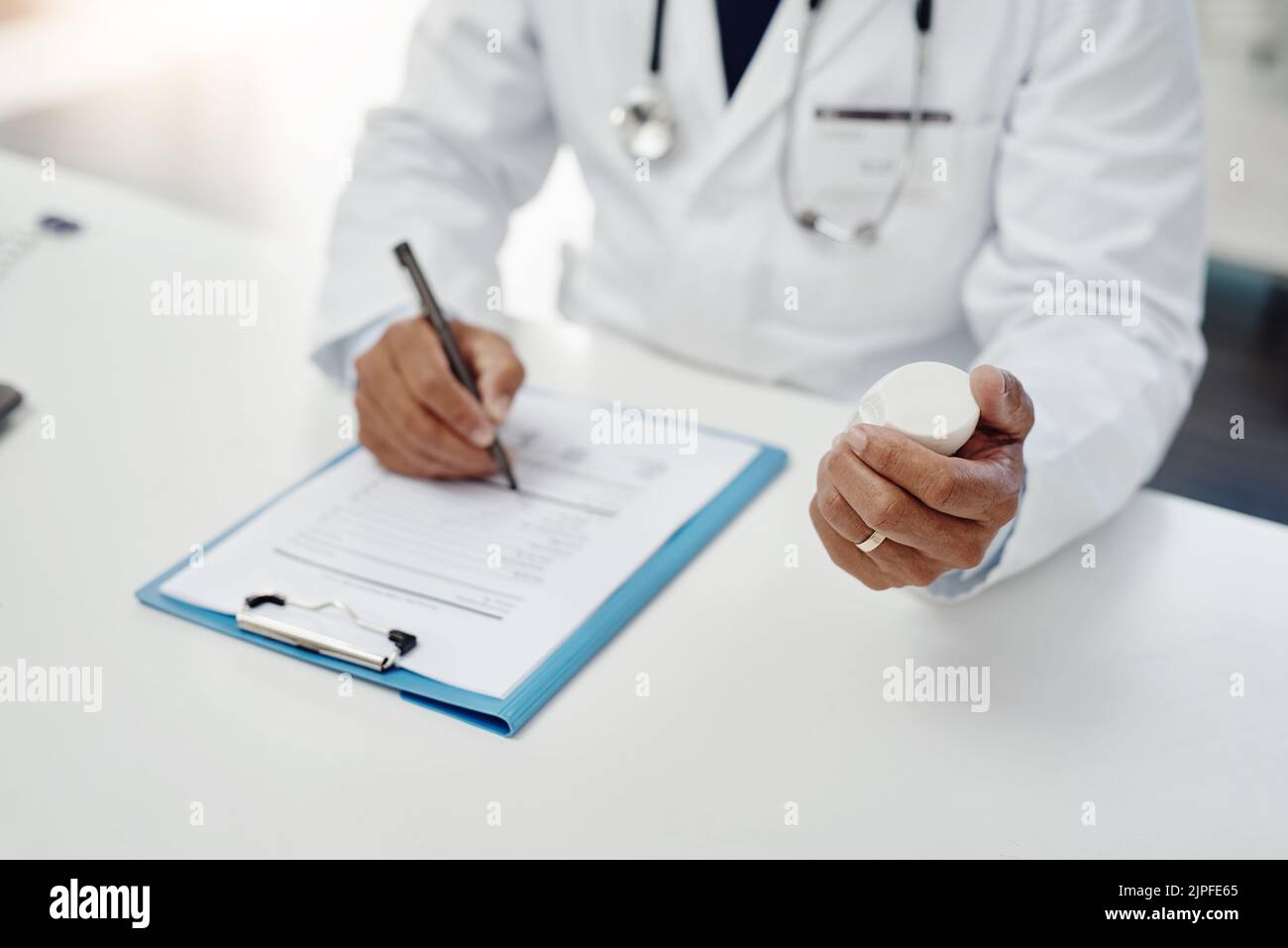 Doctor filling form workplace in hi-res stock photography and images ...