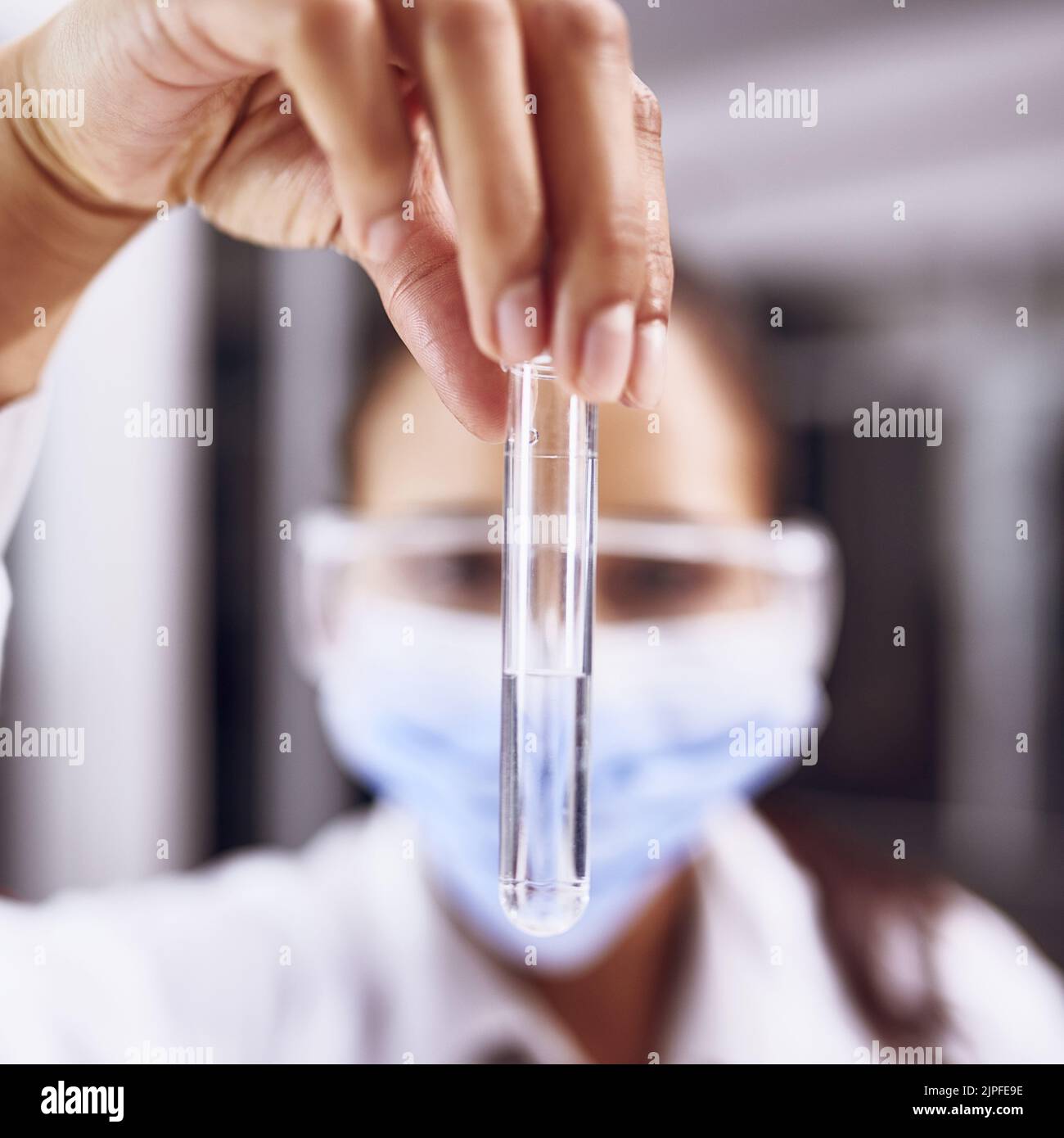 This could be the cure. a young scientist working in a lab Stock Photo ...