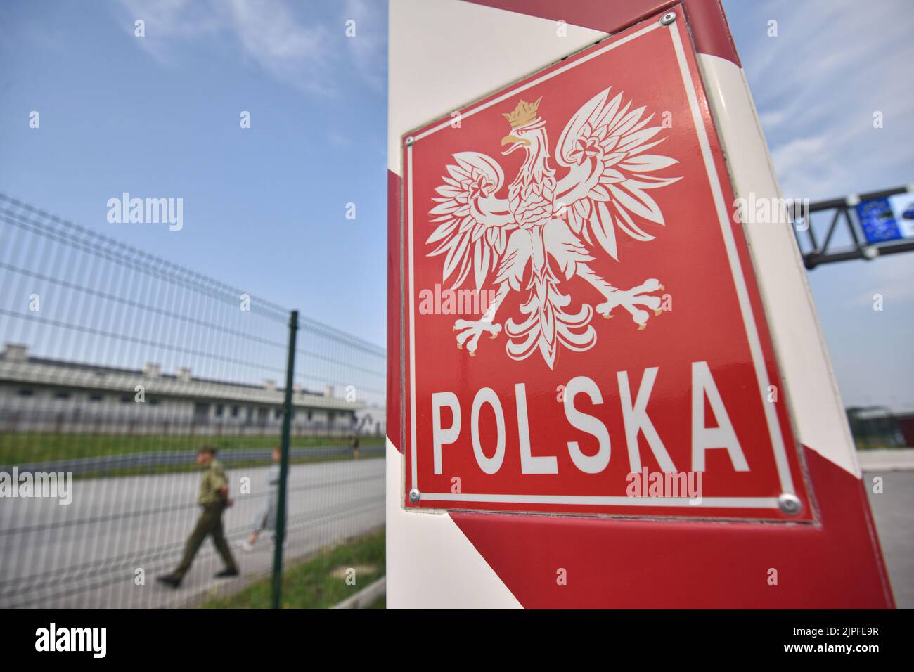 A border post with an image of the Eagle (coat of arms of Poland) and ...