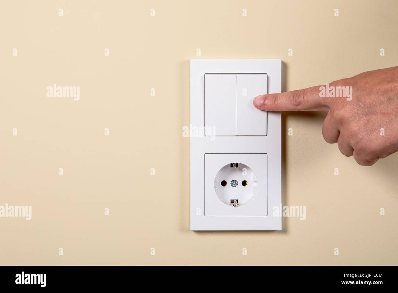 Hand on electrical switch and contact. Concept of electricity ...