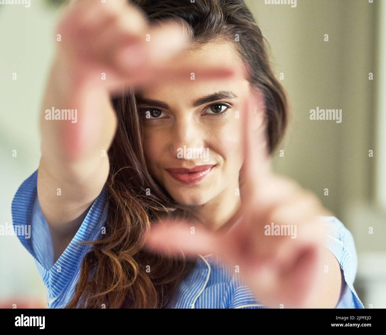 Its the perfect shot. Portrait of an attractive young woman looking at ...