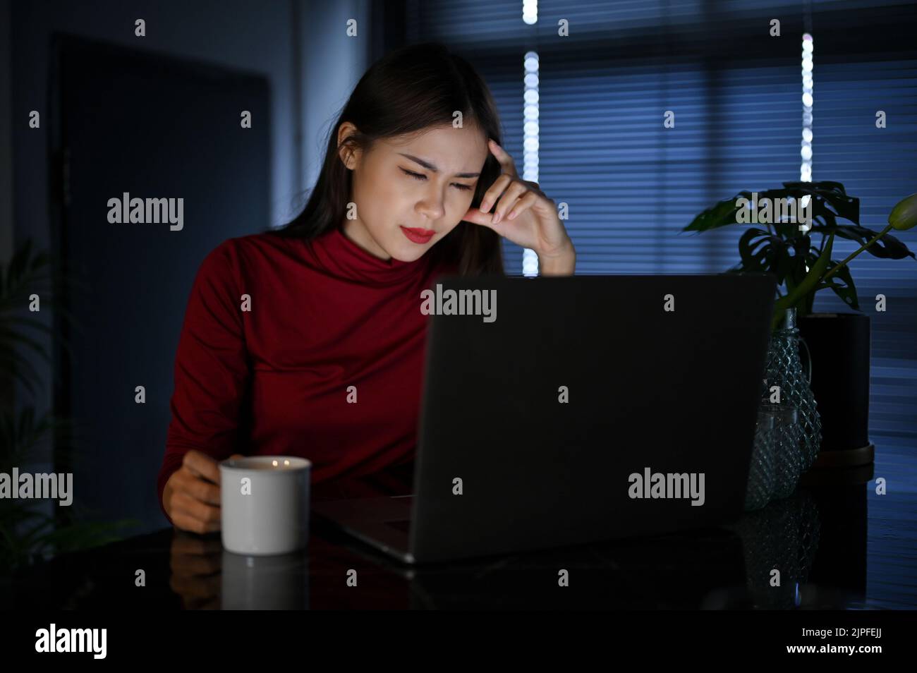 Stressed millennial Asian businesswoman or female project manager ...