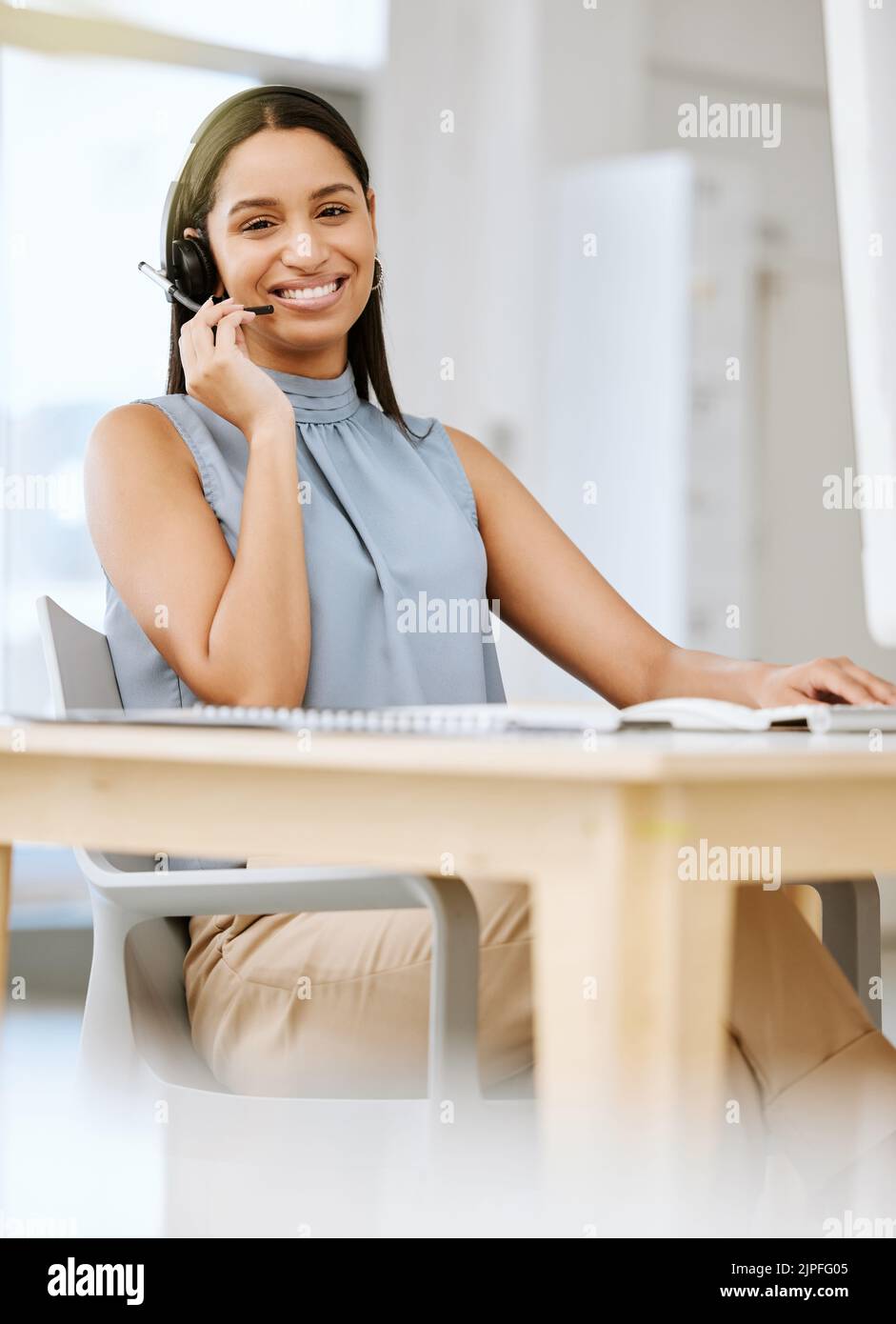 Call center agent giving advice, helping clients with headset and ...