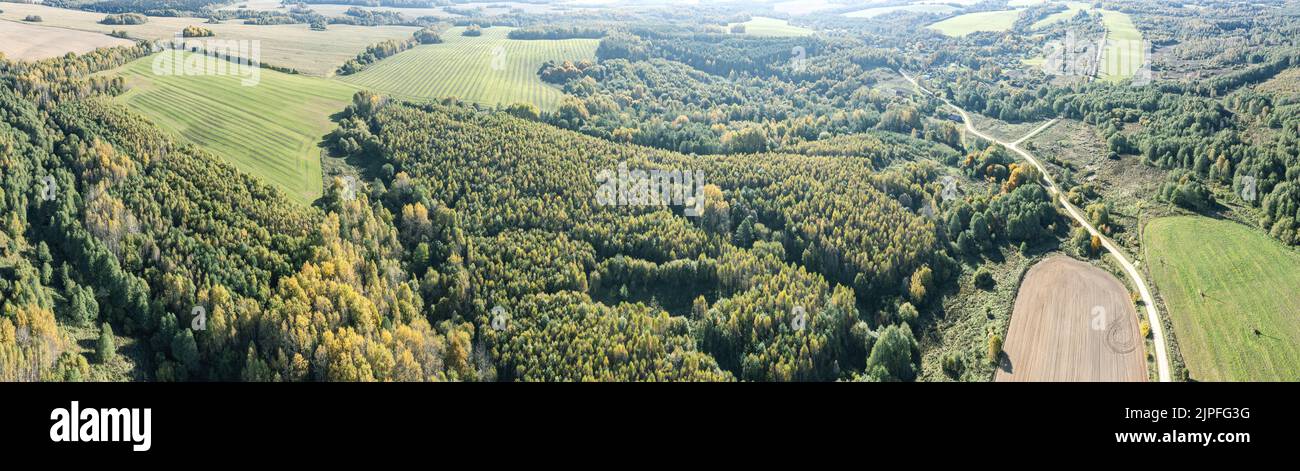 aerial panoramic countryside landscape with green forest and farmland ...