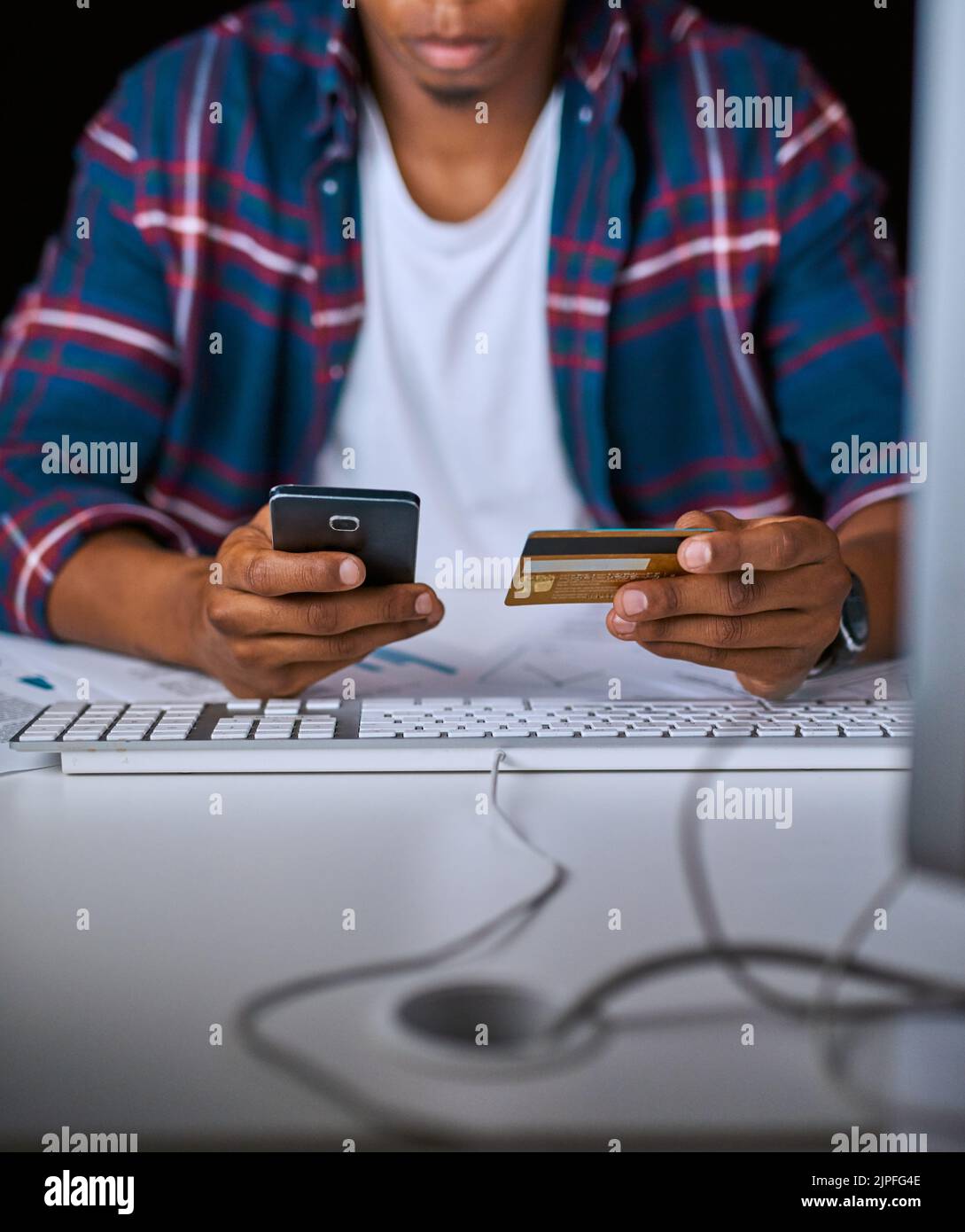 Mobile banking. an unrecognizable man doing online banking using his ...