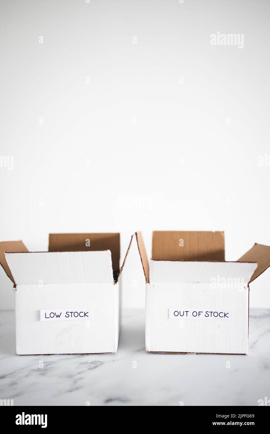 Low stock and out of stock texts on white delivery parcels on white ...