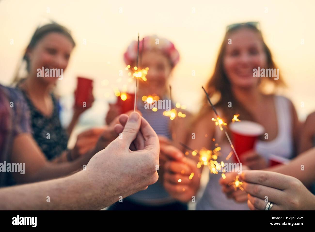Putting some sparkle into the day. young people hanging out at the ...
