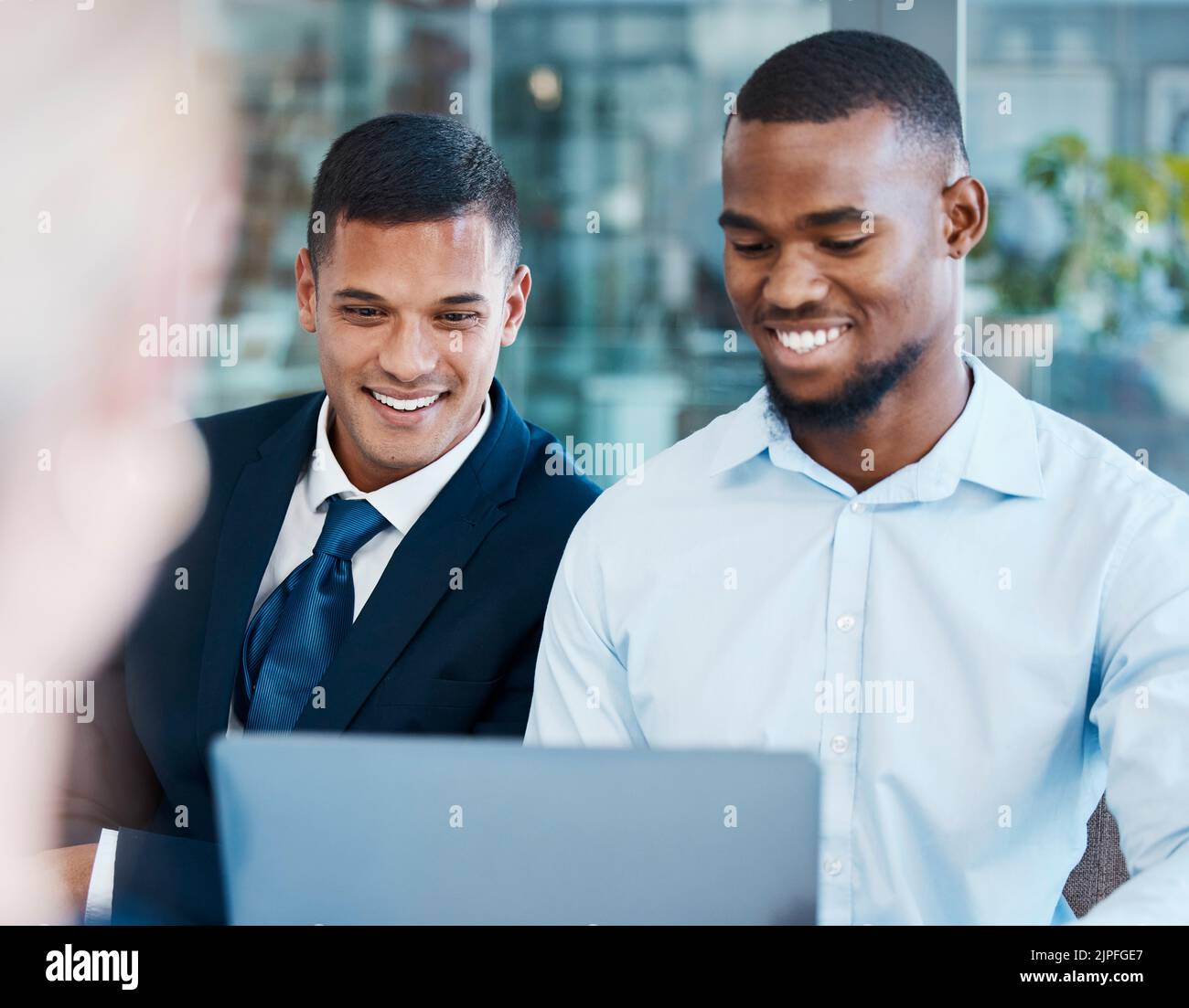Cooperation, teamwork and working together on laptop male colleagues ...