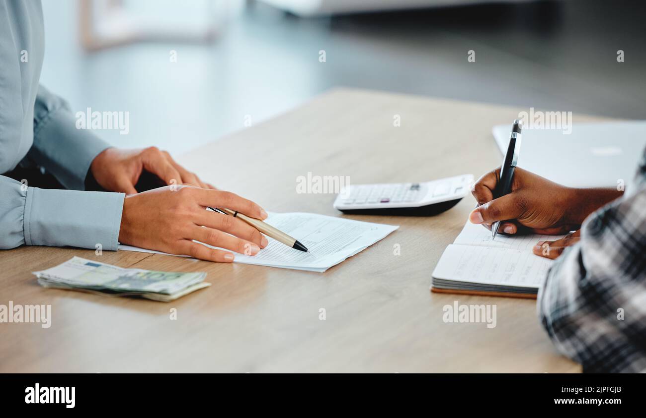 Closeup of a team of finance employees calculating company business ...