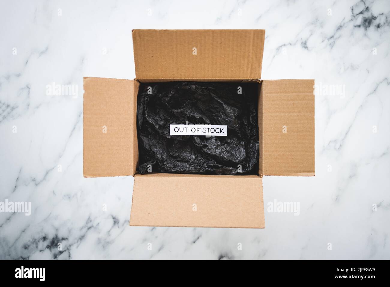 Out of stock text inside of empty delivery parcel with black padding on ...