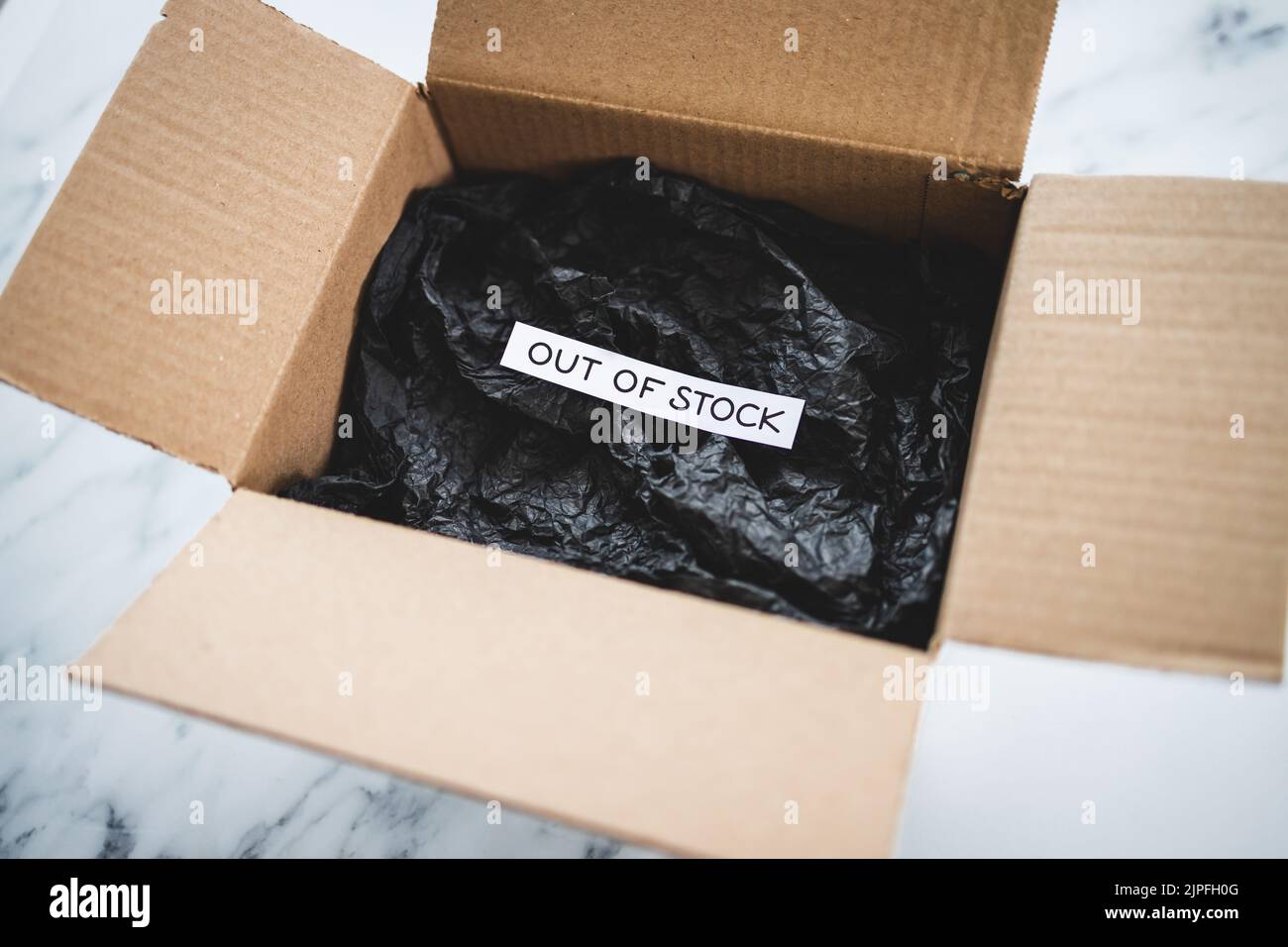 Out of stock text inside of empty delivery parcel with black padding on ...