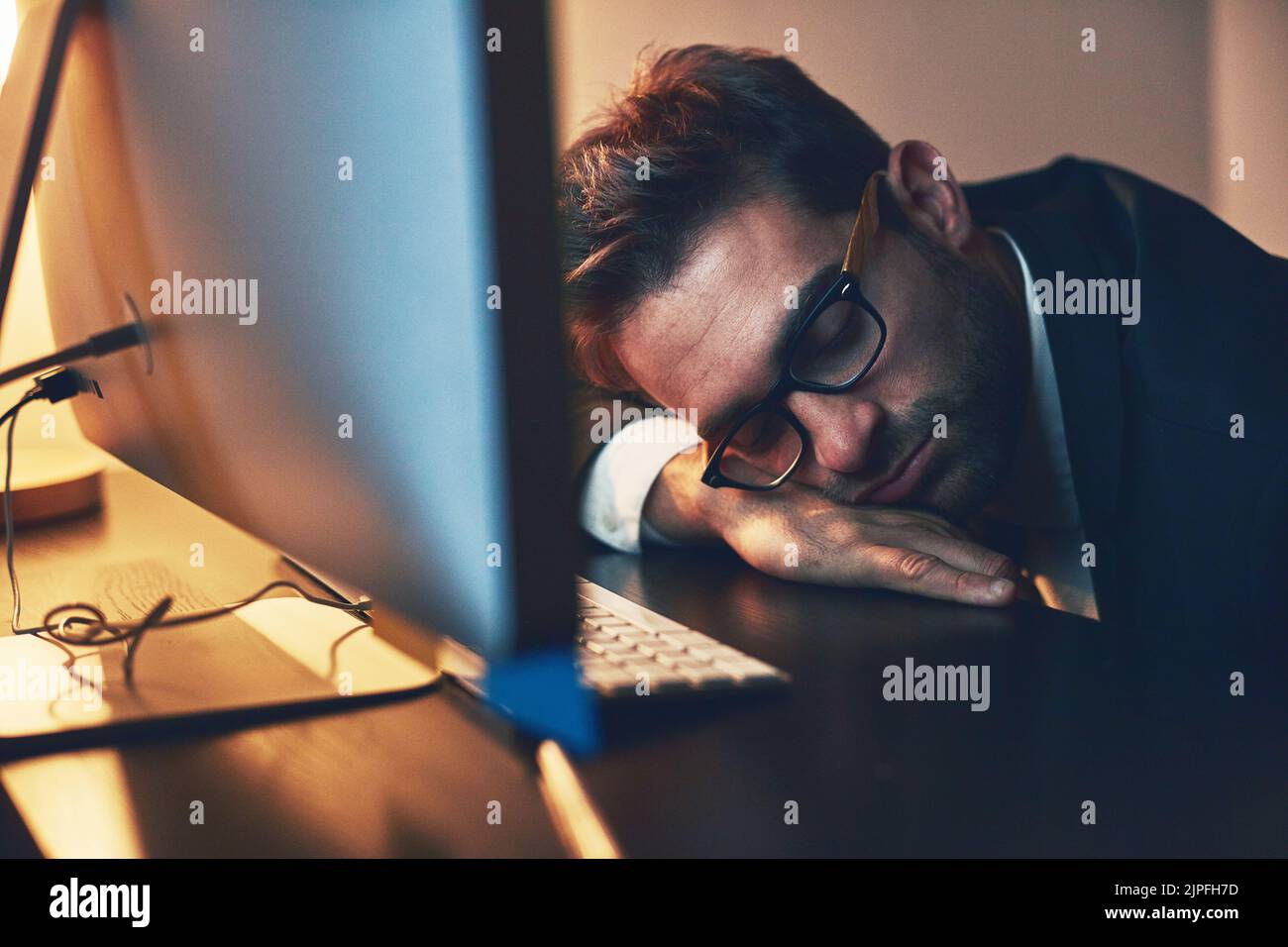 He fell asleep at his desk. a young businessman asleep at his desk ...