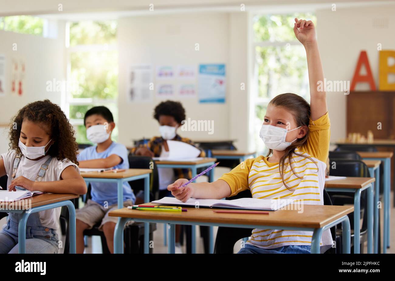 Wearing face mask to protect from covid while learning in class ...