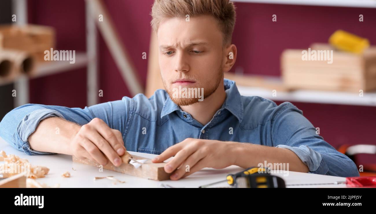 Male builder chisel worker hi-res stock photography and images - Alamy