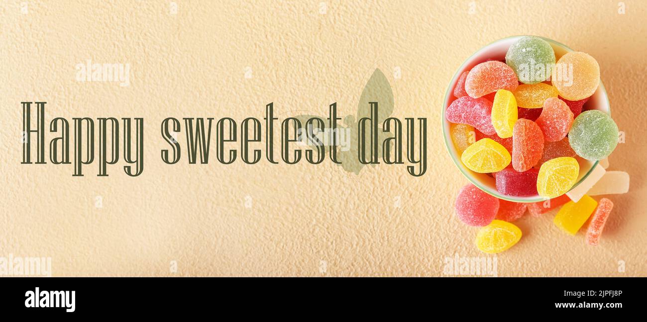 Bowl with jelly candies on beige background. Happy Sweetest Day Stock ...