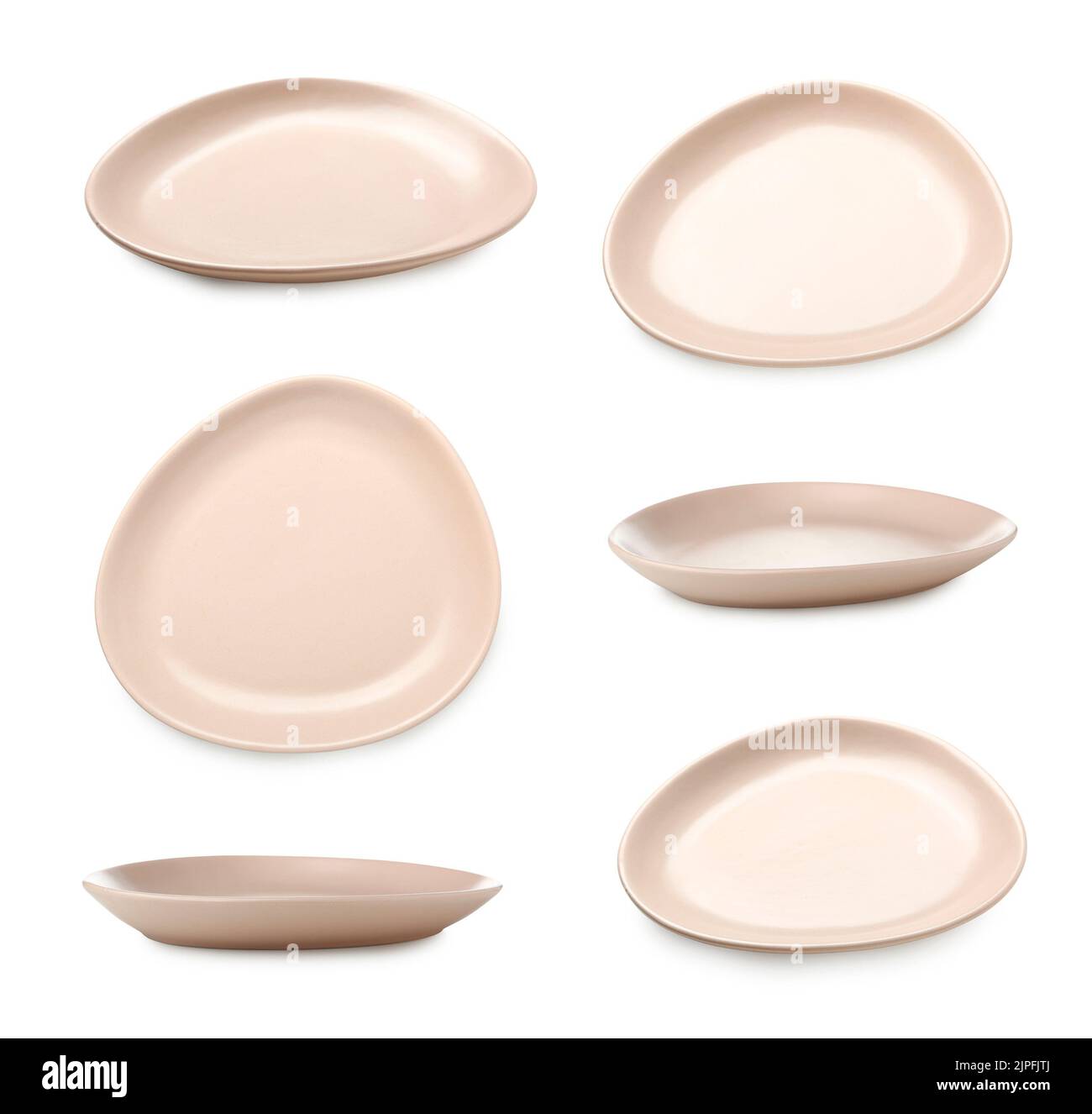 Set of beige ceramic plates isolated on white Stock Photo - Alamy