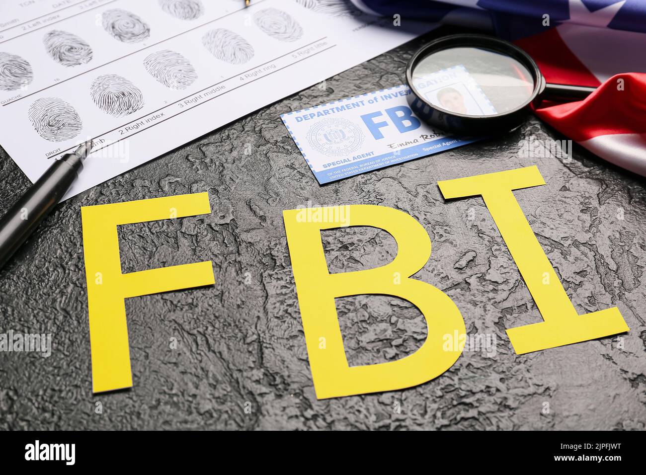 Abbreviation FBI with magnifier, finger prints and document of agent on ...