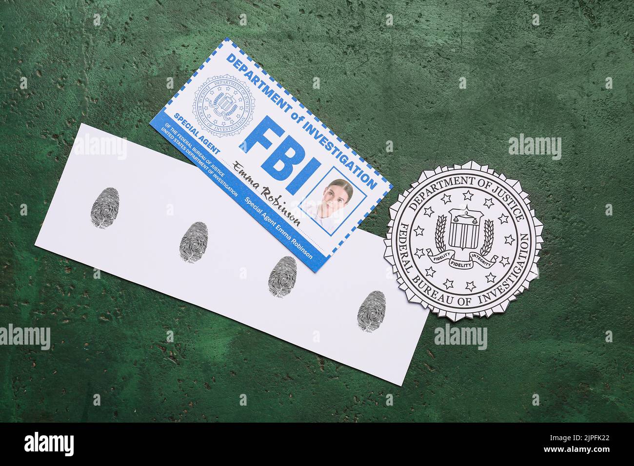Paper sheet with finger prints, document of FBI agent and seal on color ...