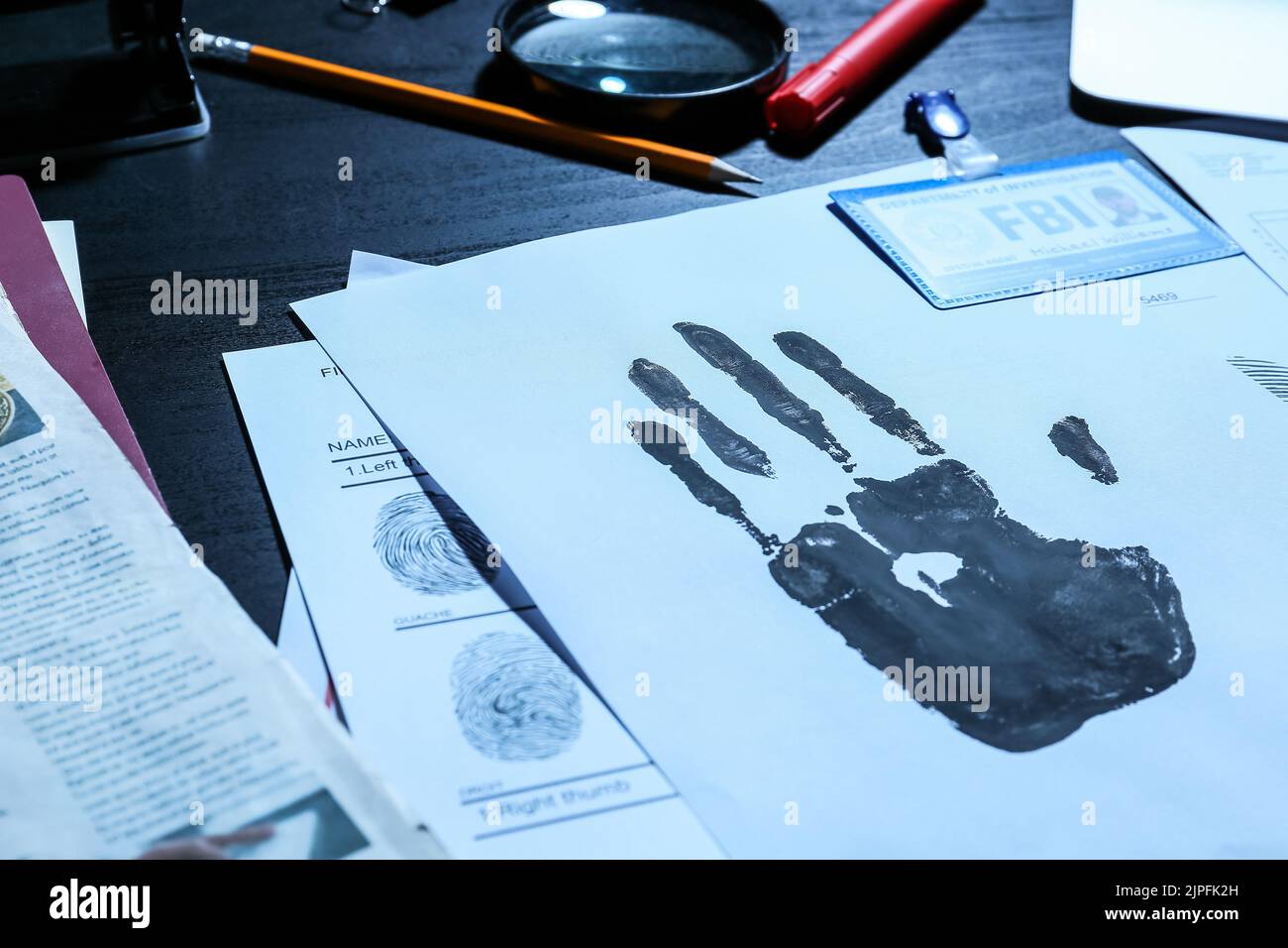 Paper sheets with different prints at workplace of FBI agent Stock ...