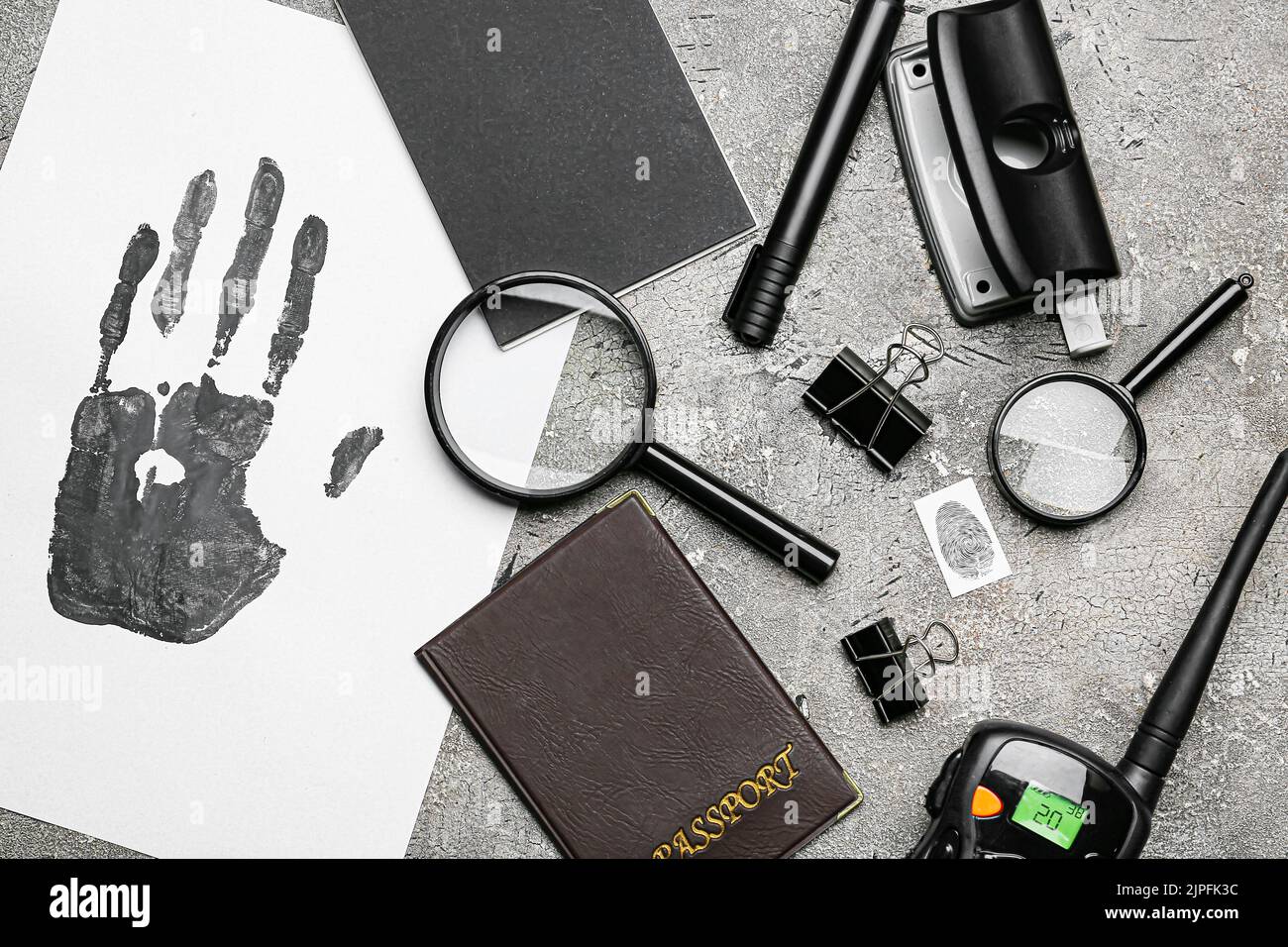 Paper sheet with palm print, passport and accessories of FBI agent on ...