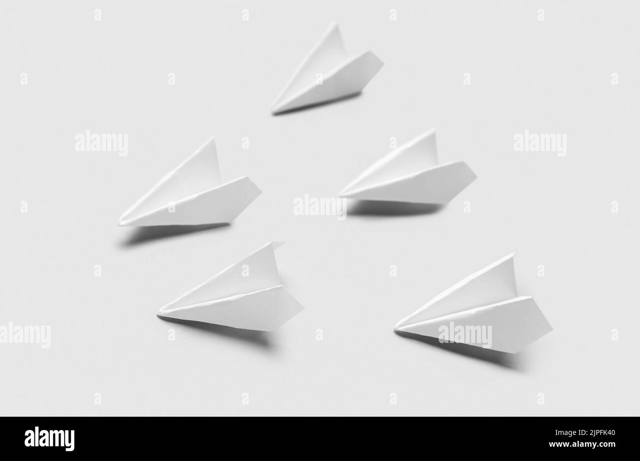 Paper planes on grey background Stock Photo - Alamy