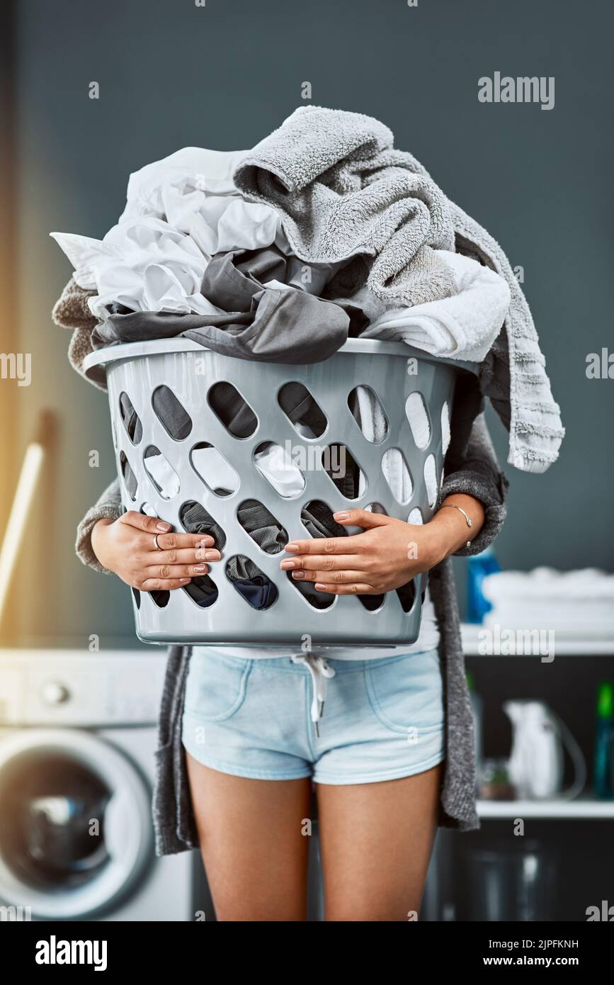 So much to do but Im ready. an unrecognizable woman doing her laundry ...