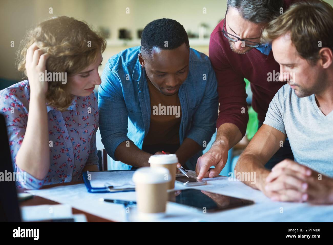 The development of a brand new app. a diverse group of businesspeople ...