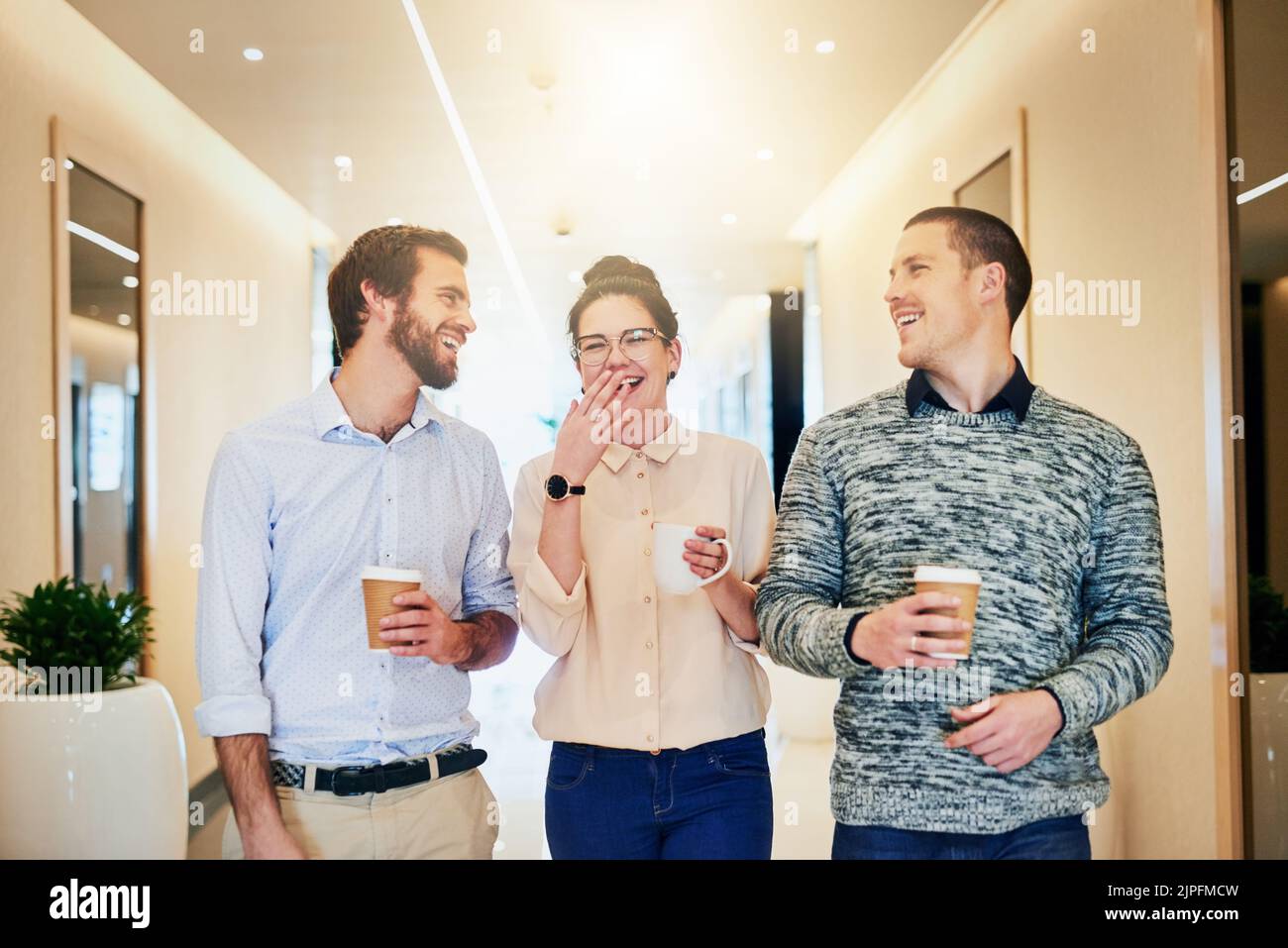 Its time for a coffee break. Portrait of a group of young ...