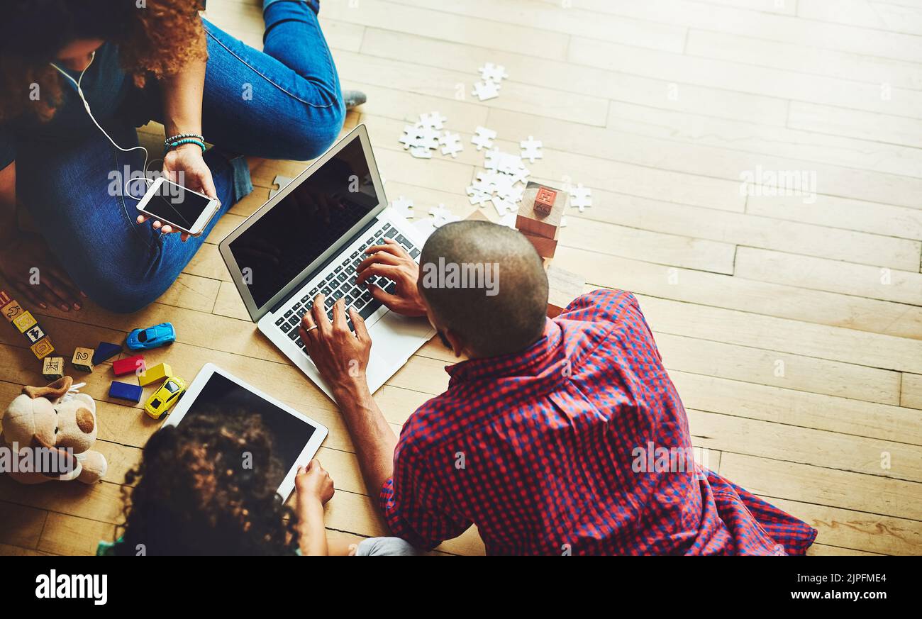 Entertained with the devices of our choice. a family of three using ...