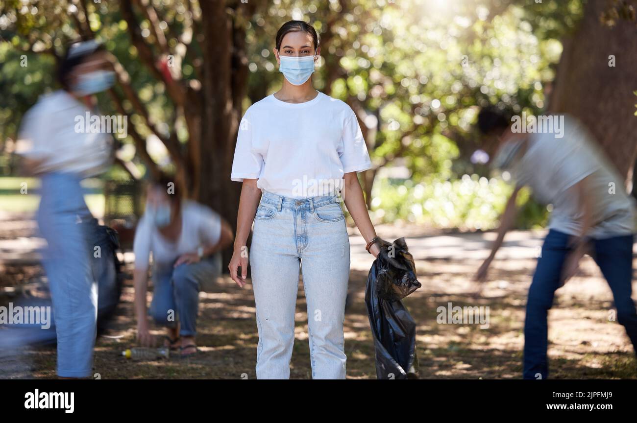 Volunteers, hygiene and environmental team cleaning a park in covid ...