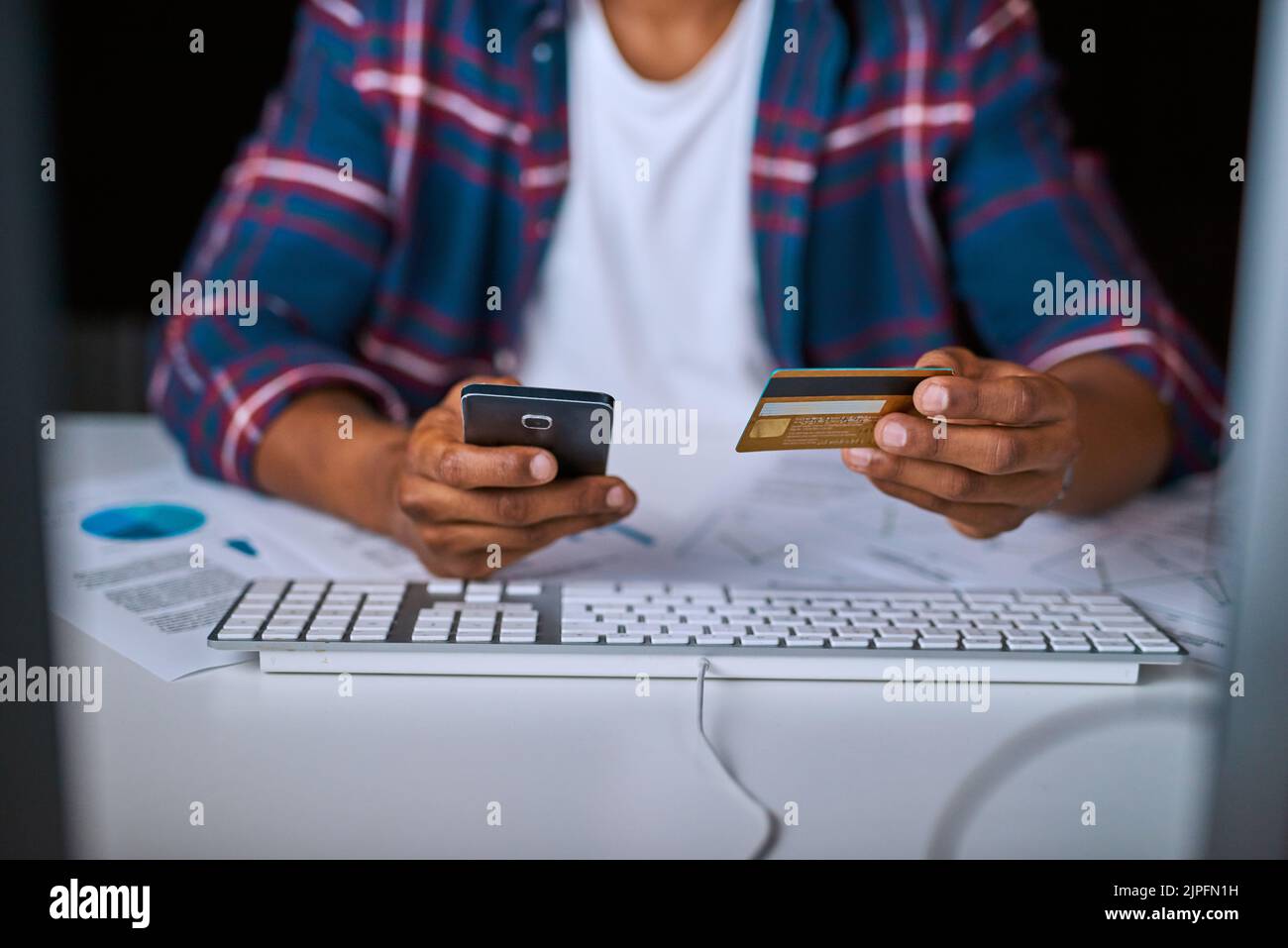 Inputting his banking details. an unrecognizable man doing online ...
