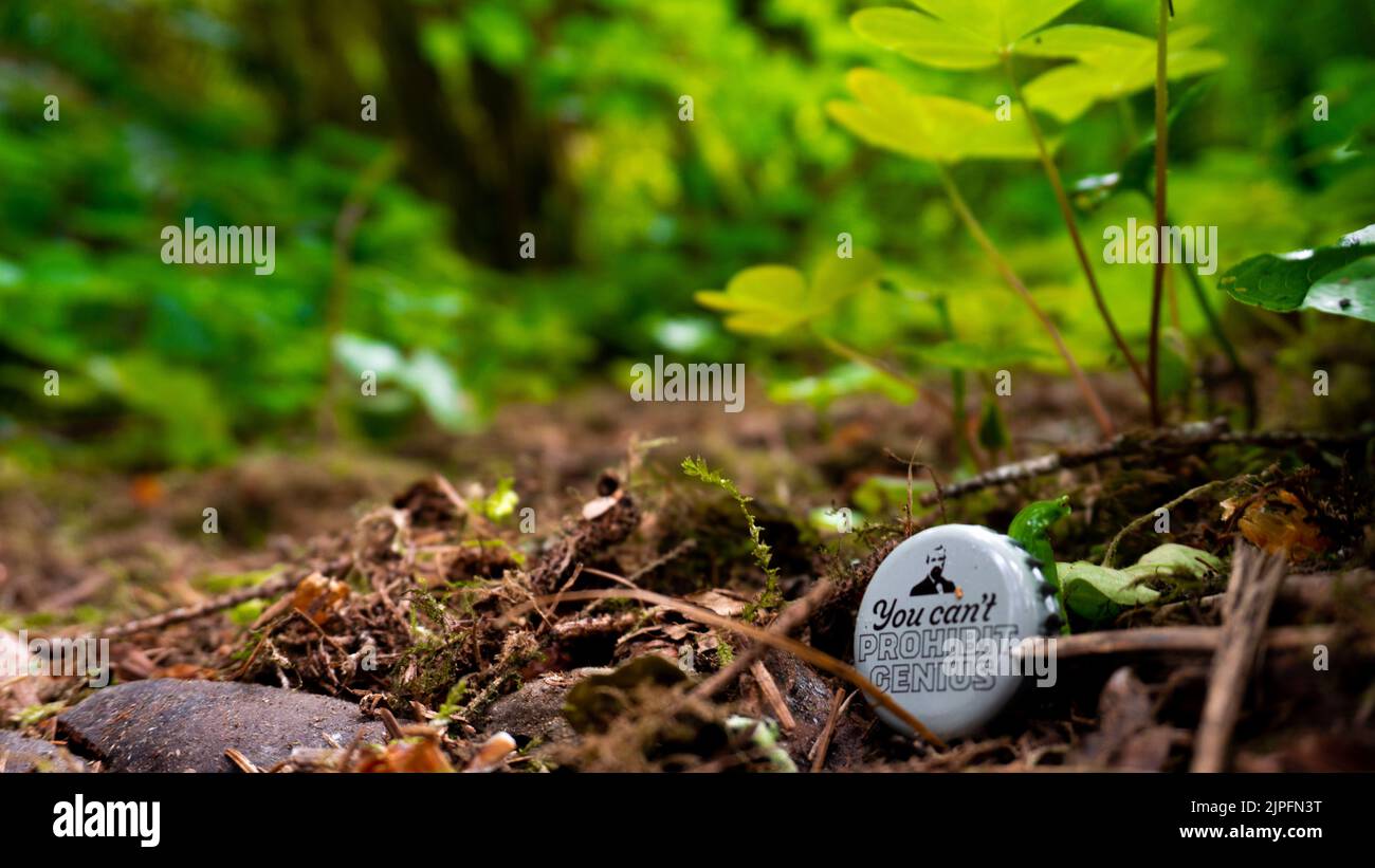 A close-up view of the "You can't prohibit genius" bottle cap on the ...