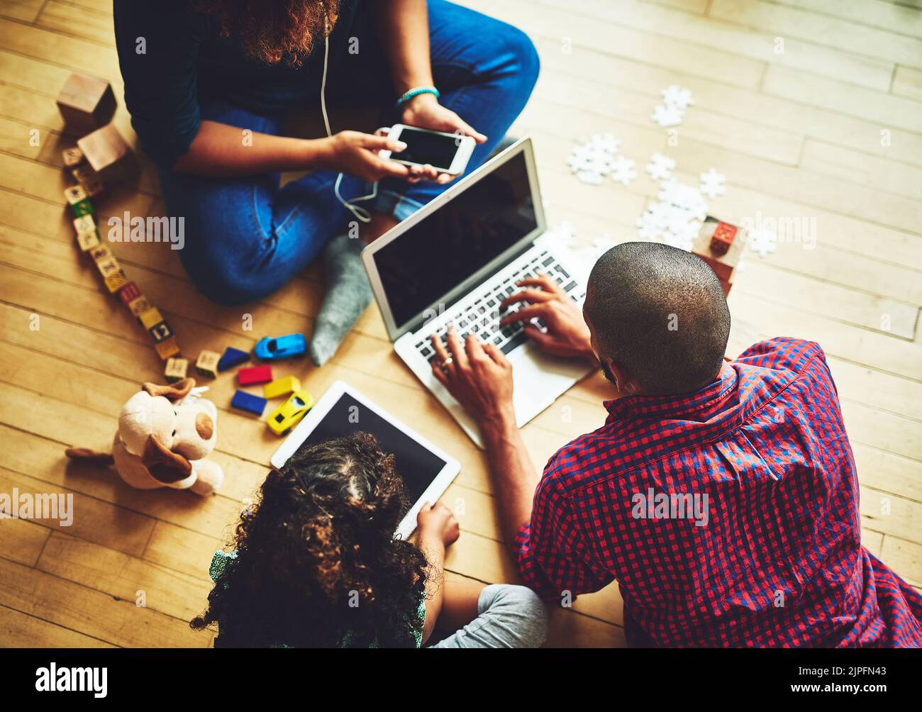 Theres something fun for everyone online. a family of three using ...