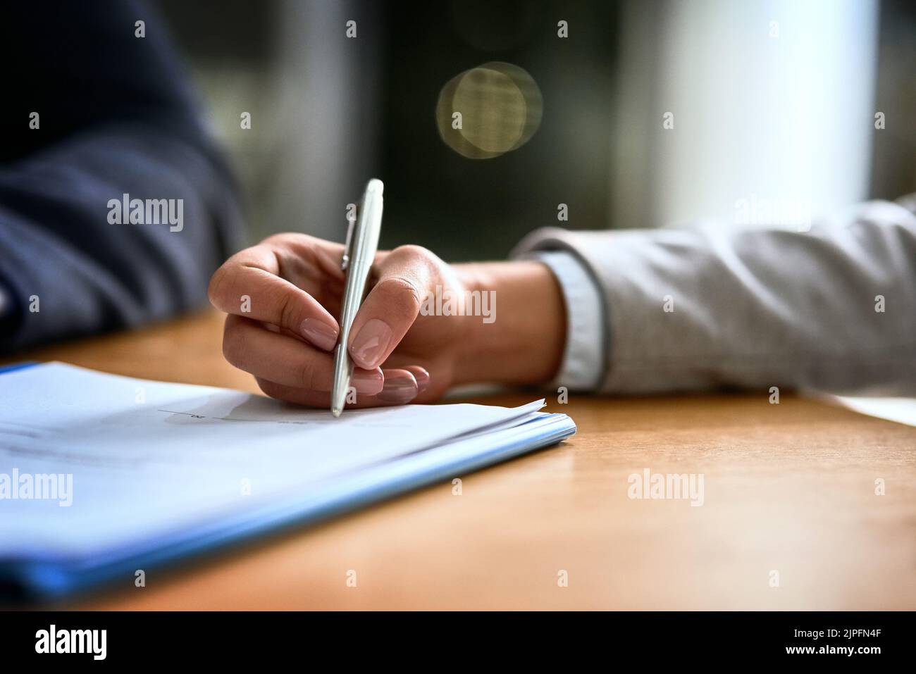 Every contract comes with fine print. a businessman and businesswoman ...