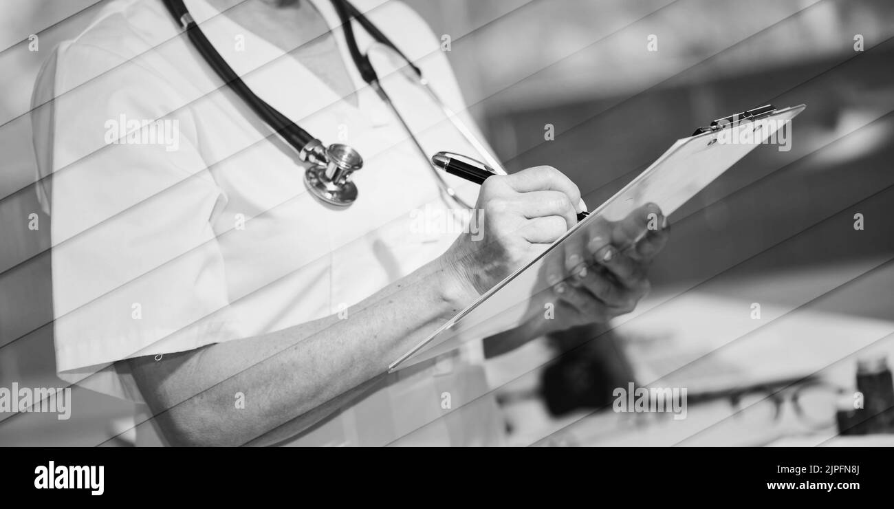 Doctor clipboard standing in Black and White Stock Photos & Images - Alamy